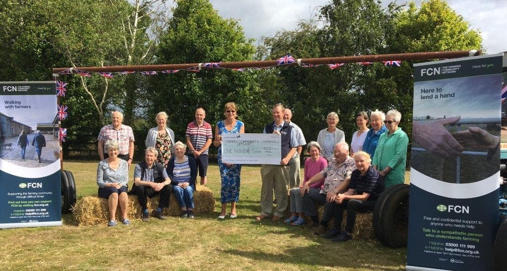 Exbourne choir gives £1,000 to Farming Community Network | okehampton ...
