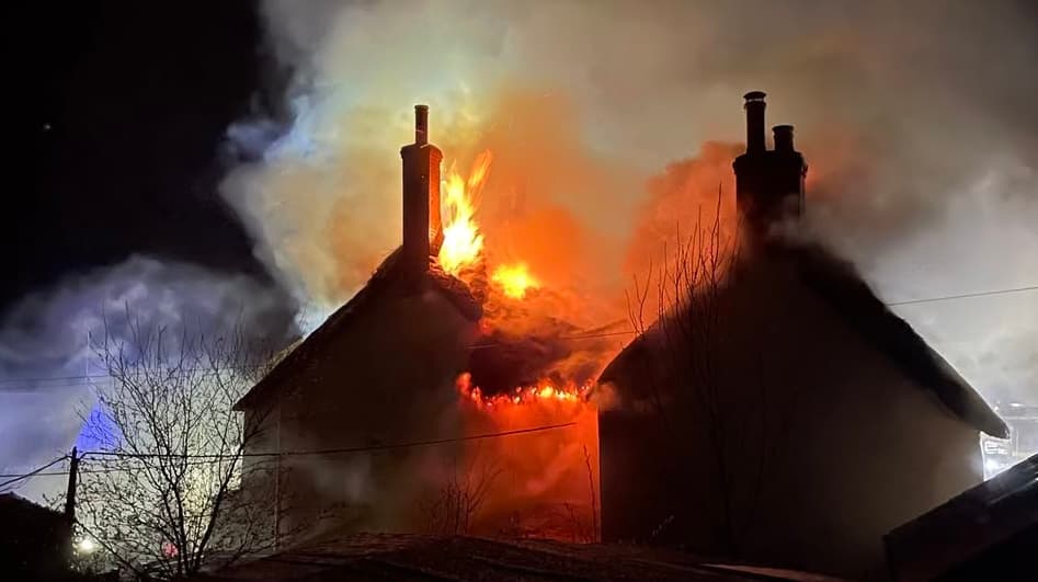 Fire crews battle major blaze in thatched cottages in village ...